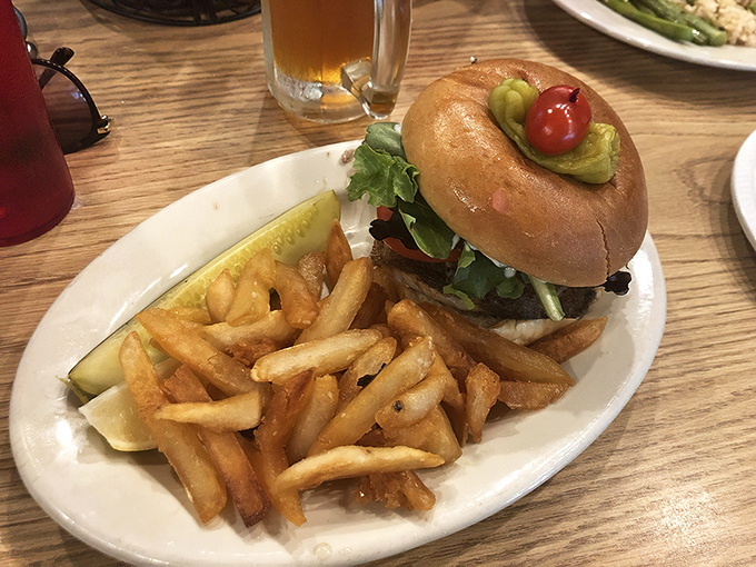 The legendary grouper sandwich in all its glory &ndash; a monument to simplicity done right. That golden-brown fillet spilling over the edges of the bun is Florida's edible sunshine. 