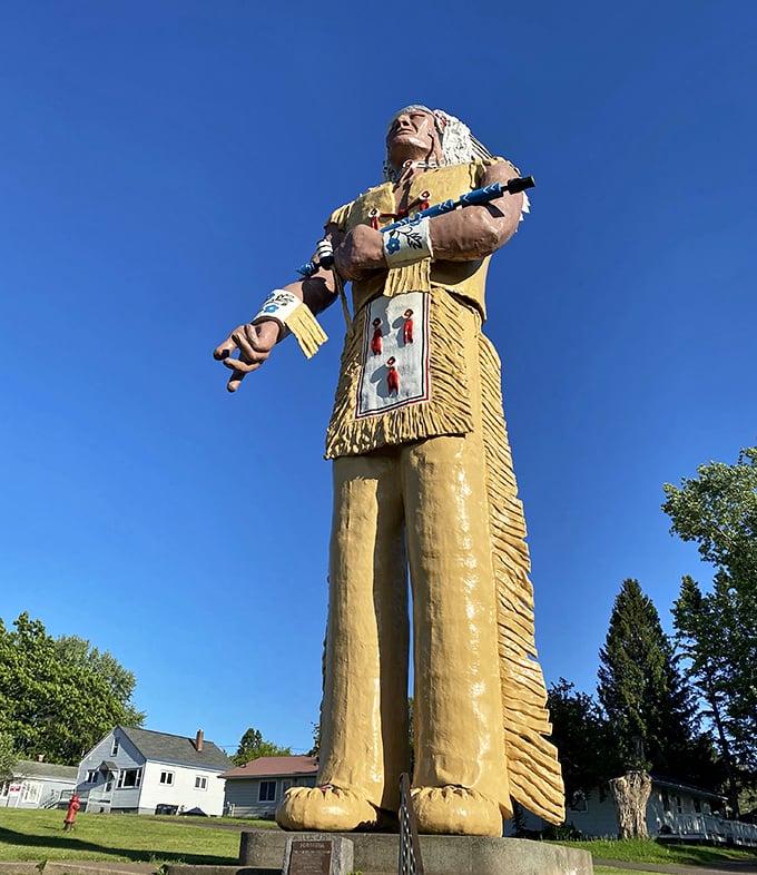 Hiawatha stands tall against the Michigan sky, arms outstretched as if to say, "Yes, I'm really this big, and yes, you need a photo."