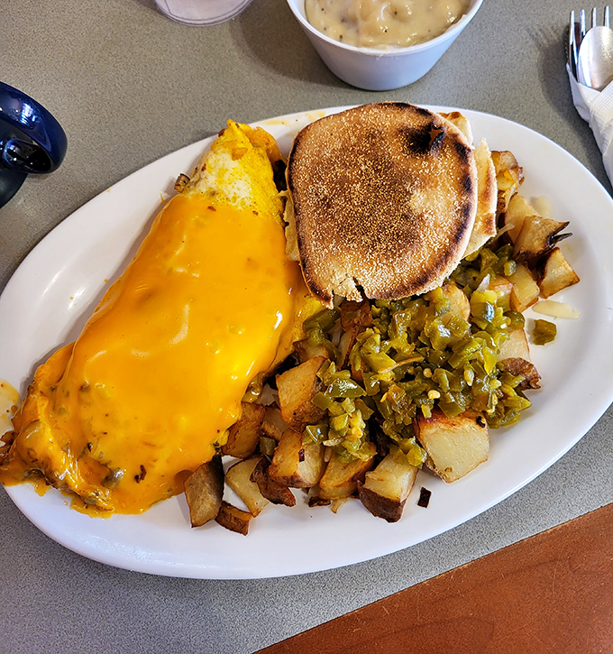 An omelet smothered in cheese, potatoes crisped to perfection, and green chilies adding that Southwestern kick&mdash;breakfast in Arizona doesn't get more authentic than this.