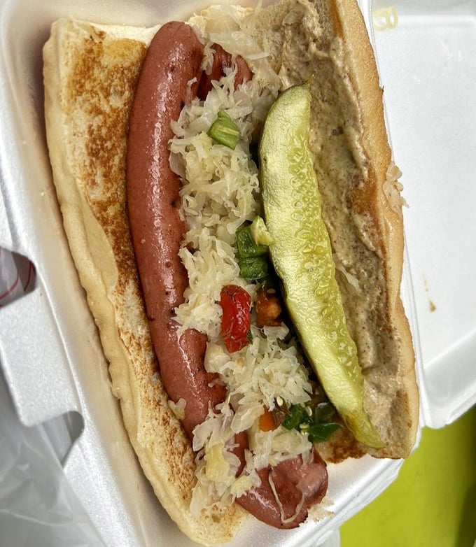 The classic hot dog gets the deli treatment with sauerkraut and pickle&mdash;proof that simple food done right is culinary poetry.