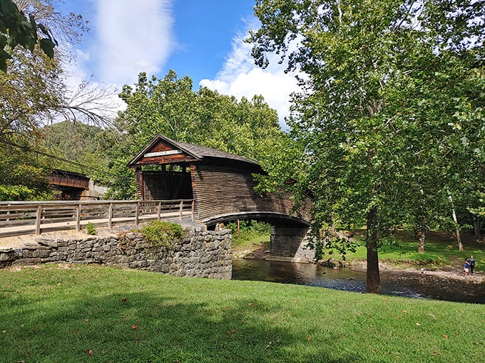 Humpback Bridge arches gracefully over calm waters, a wooden testament to engineering that predates computer design and smartphone navigation.