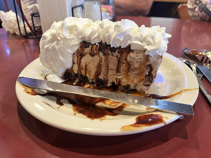 When a slice of ice cream pie looks this good, dessert isn't optional&mdash;it's mandatory. The whipped cream mountain alone deserves its own zip code.