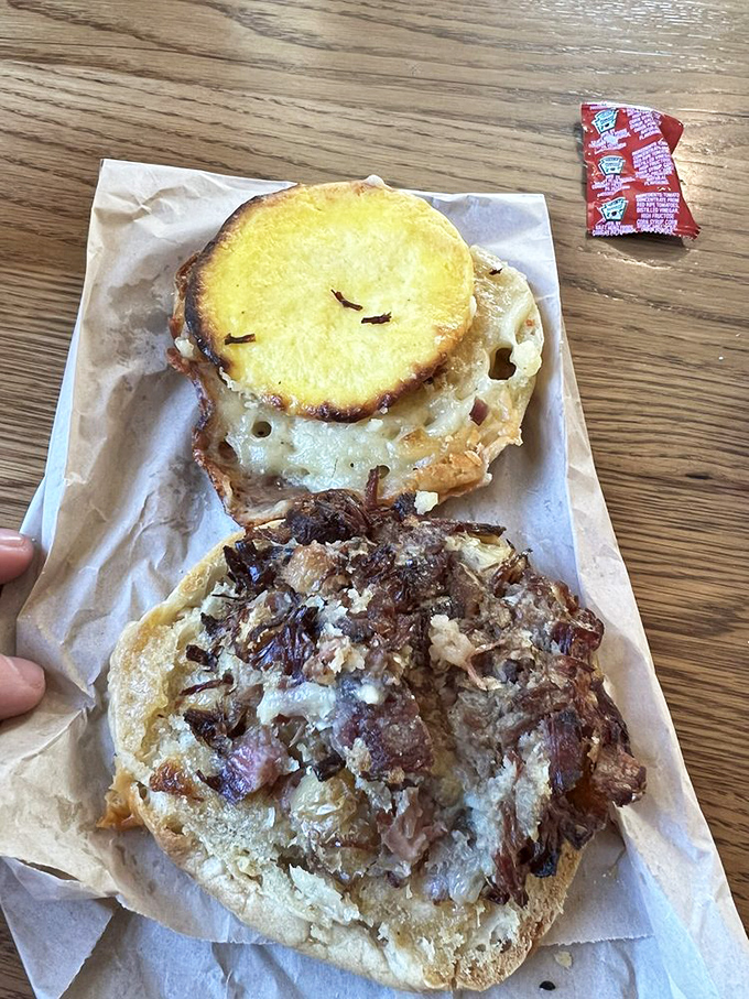 This isn't just a breakfast sandwich&mdash;it's morning salvation between bread. Those caramelized onions and melted cheese are working overtime on flavor duty.