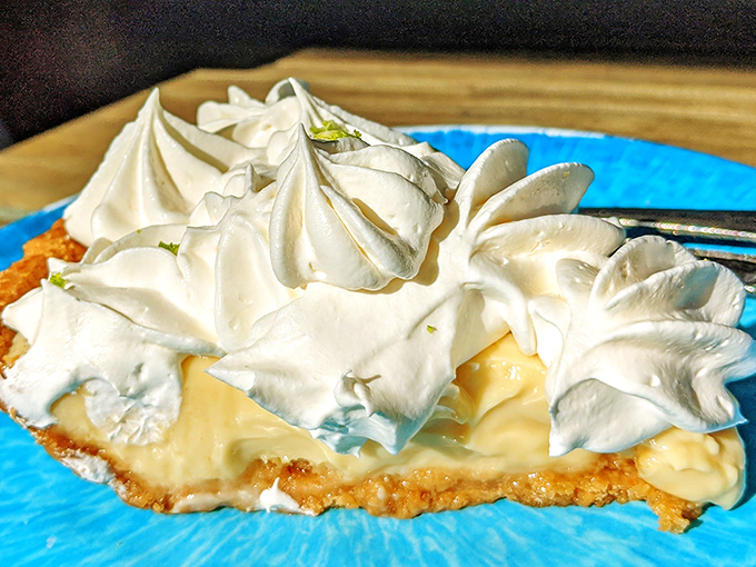 Key lime pie topped with clouds of whipped cream that make you wonder if heaven might actually be a dessert after all.
