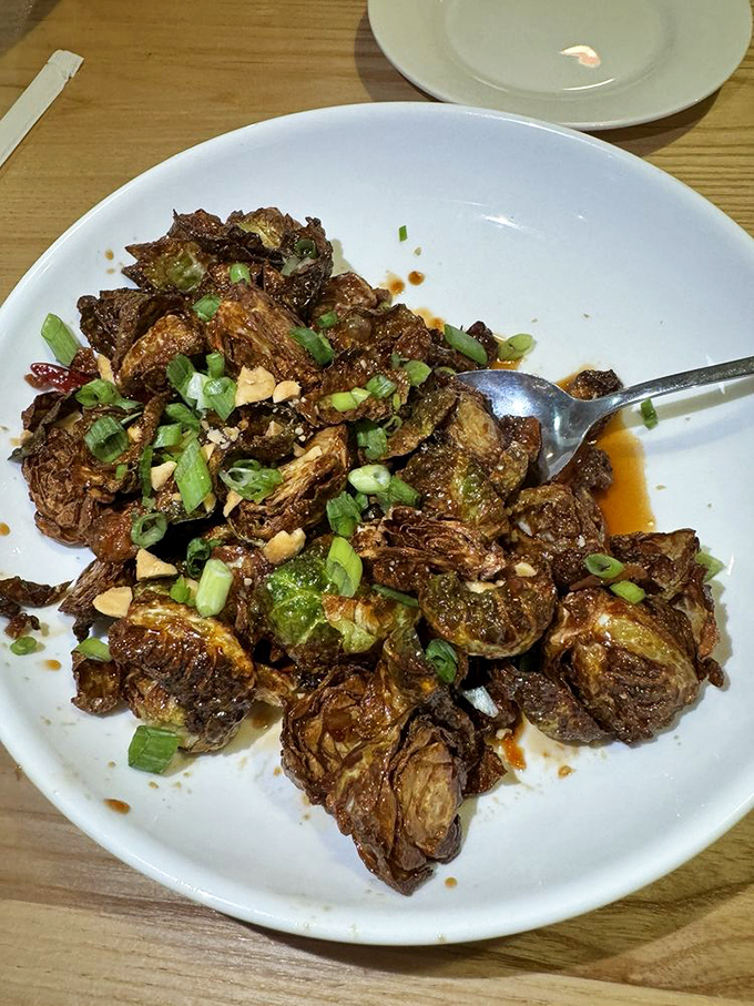 These aren't your grandmother's Brussels sprouts. Crispy, savory, and topped with scallions and peanuts&mdash;vegetable redemption at its finest.