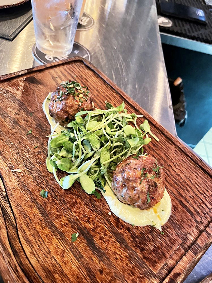 These lamb meatballs don't just sit on the plate&mdash;they perform, with supporting actors avocado cr&egrave;me and microgreens stealing scenes.