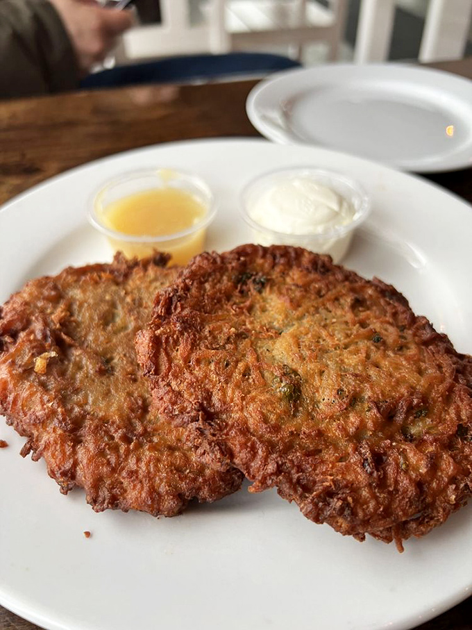 Golden, crispy latkes that would make your grandmother nod in approval&mdash;paired with the traditional accompaniments of sour cream and applesauce.
