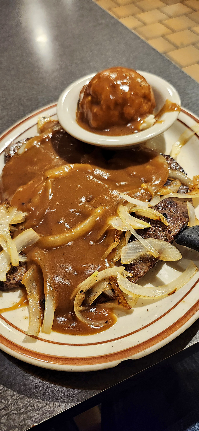 That liver and onions isn't just a meal, it's a time machine to Sunday dinners at grandma's house&mdash;complete with soul-warming gravy.