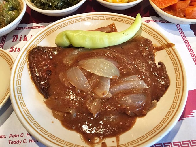 Liver and onions&mdash;the dish that separates casual diners from true food enthusiasts&mdash;served with a pepper garnish that says, "Yes, we're serious about this."