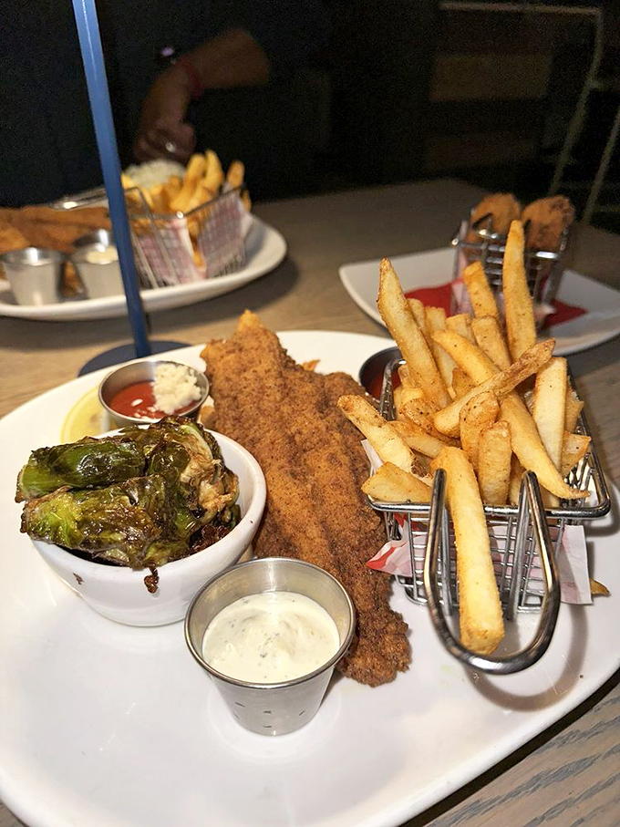 Louisiana meets Georgia on this plate. Perfectly fried catfish and jumbo shrimp nestle alongside roasted Brussels sprouts for a Southern-coastal mashup.
