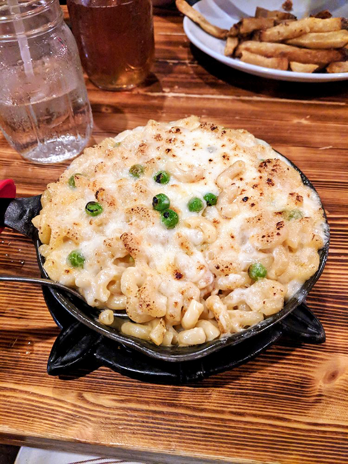 Mac and cheese that doesn't just comfort&mdash;it embraces you. Those crispy edges and green peas add textural contrast to creamy, cheesy perfection.