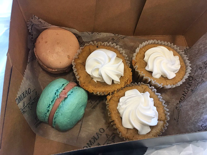 Colorful macarons join forces with pumpkin cheesecakes in this box of joy. It's like the United Nations of desserts, bringing peace through sugar.