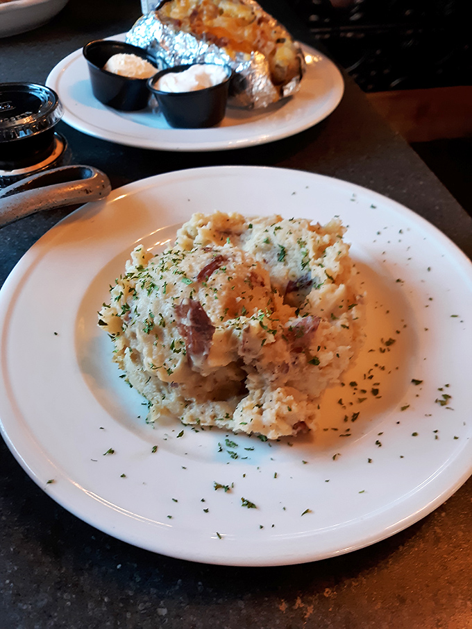 These aren't just mashed potatoes; they're cloud-like pillows of comfort dusted with herbs that your grandmother wishes she could make.