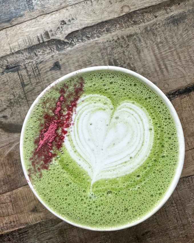 The vibrant green matcha latte, adorned with a heart and pink accent, isn't just a drink&mdash;it's a mood-altering experience that energizes without the coffee jitters.