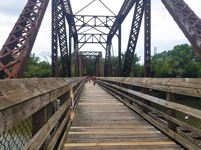 This historic iron bridge spans more than just water&mdash;it connects Danville's industrial past with its recreational present through weathered wood and sturdy steel.