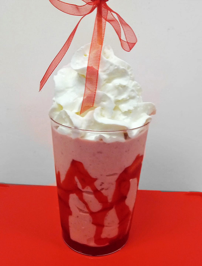 This strawberry shake isn't just a drink, it's dessert with a straw&mdash;complete with whipped cream mountain and that perfect ribbon garnish. 