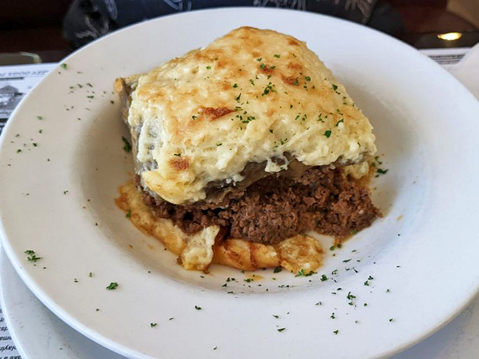 Comfort food elevated &ndash; layers of savory goodness topped with a golden blanket of cheese that makes you wonder why you'd ever order anything else.