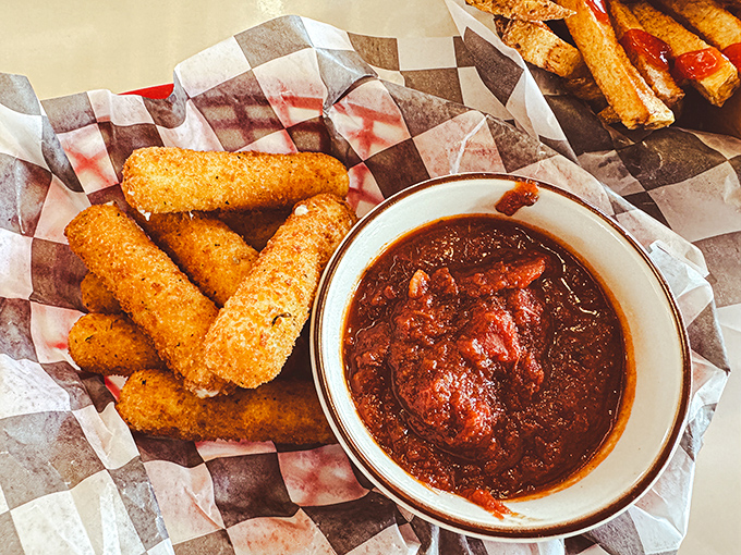 Golden mozzarella sticks paired with rich marinara sauce prove that simple pleasures are often the best.