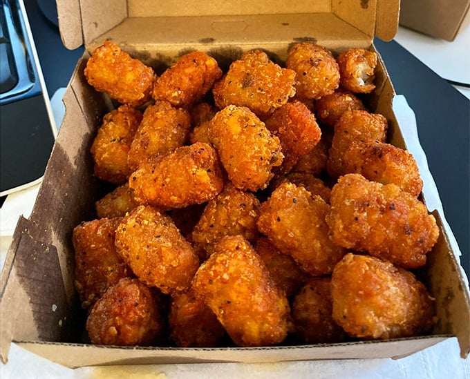 Tater tots transformed into crispy little flavor bombs. These aren't your cafeteria's tots&mdash;they're their sophisticated, worldly cousins. 