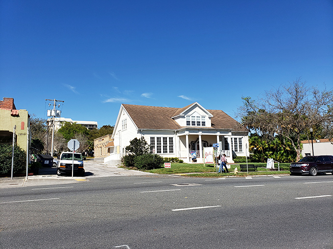This charming white building with its welcoming porch practically begs you to sit a spell and watch the world go by at a decidedly un-Florida pace.