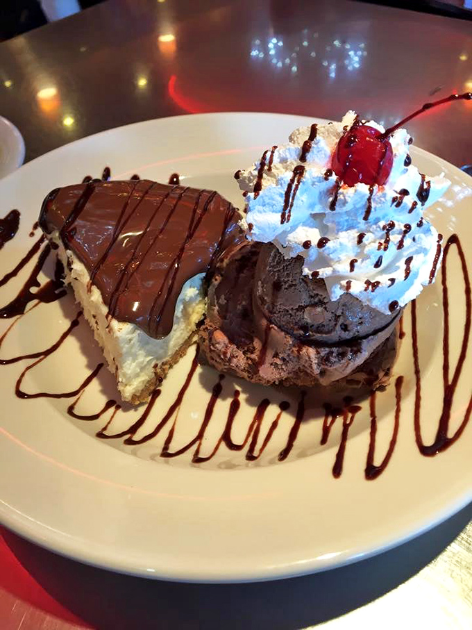 The dessert plate arrives like a Broadway duo&mdash;cheesecake and chocolate cake performing their sweet duet under chocolate drizzle spotlights.