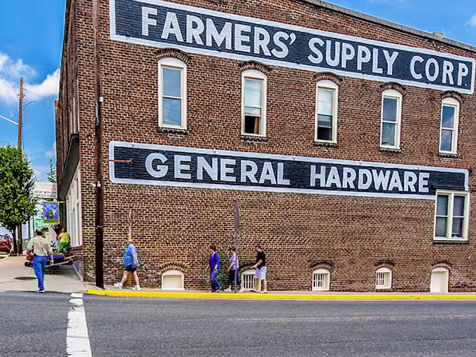 The Farmers' Supply Corp building tells stories through its weathered brick, where locals still gather to solve the world's problems one conversation at a time.