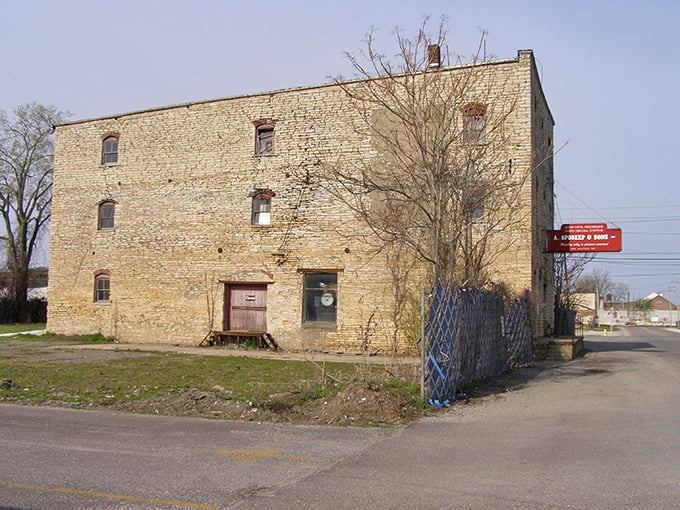 This weathered limestone warehouse has the thousand-yard stare of a building that's seen it all. Industrial archaeology at its most authentic.