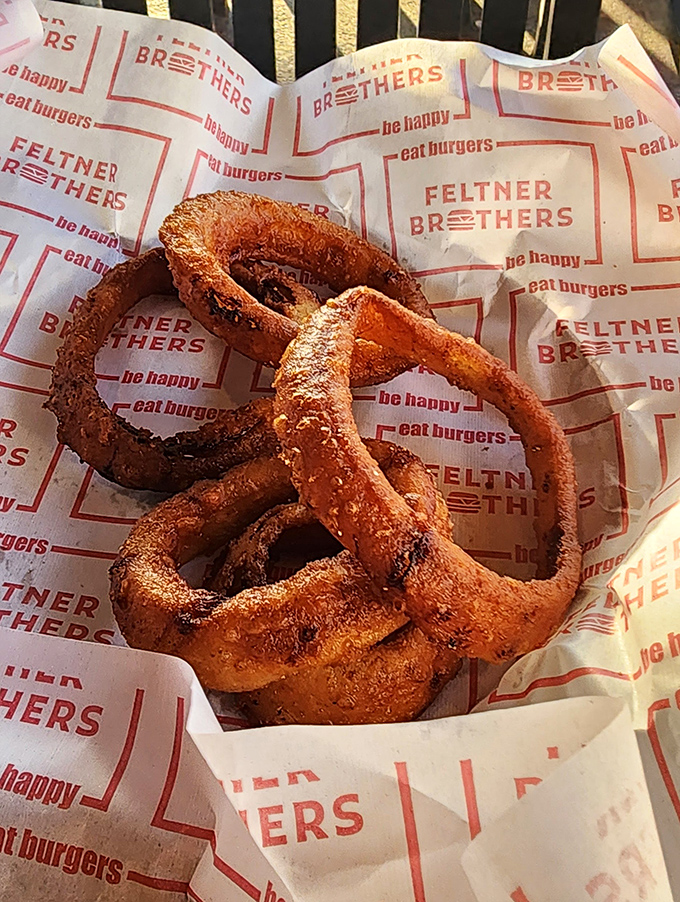 Onion rings with the structural integrity of Olympic medals and twice the value to those who appreciate proper frying technique.