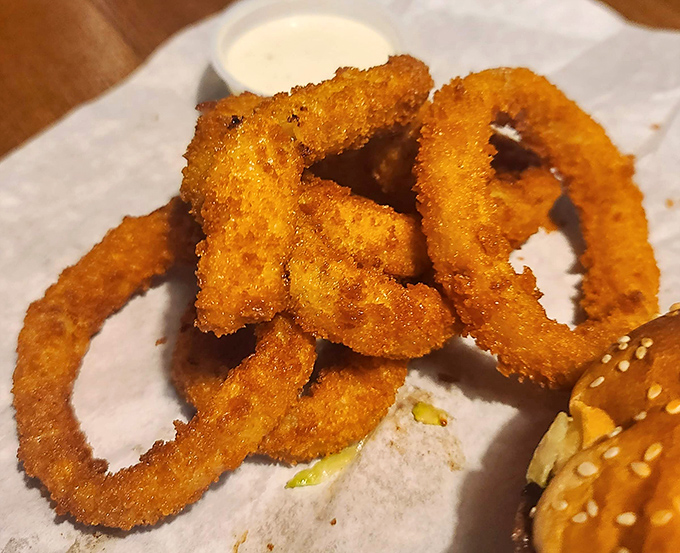 Onion rings so perfectly golden and crispy, they deserve their own trophy. The supporting actor that frequently steals the show.
