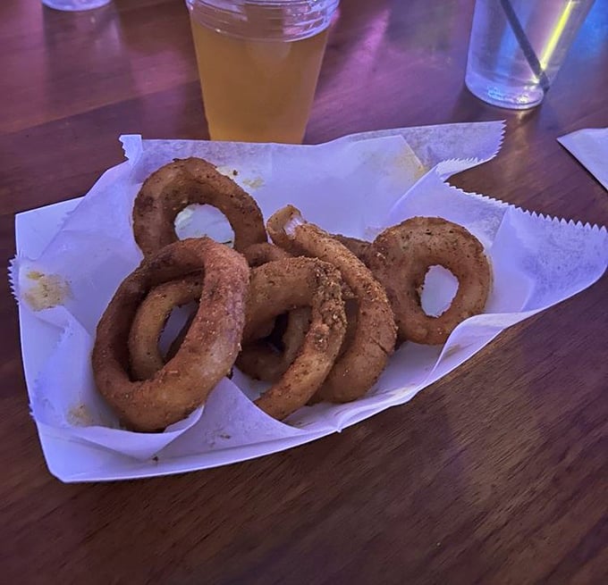 Onion rings that achieve that perfect golden ratio of crispy coating to sweet, tender onion. Beer's best friend has arrived.