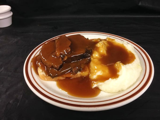 Open-faced roast beef that doesn't hide behind bread. The mashed potatoes stand at attention, ready to soak up that glorious gravy river.