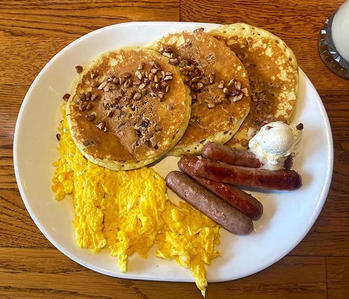 Pancakes with a sprinkle of nuts, scrambled eggs, and sausage links &ndash; the breakfast combo that launched a thousand beach walks.