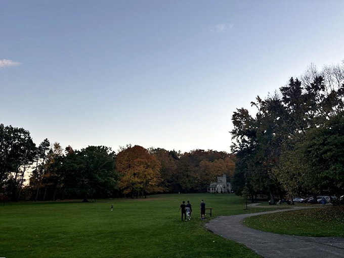 The castle reveals itself through a frame of trees, a quiet guardian of the North Chagrin Reservation that seems to whisper, "Come closer."