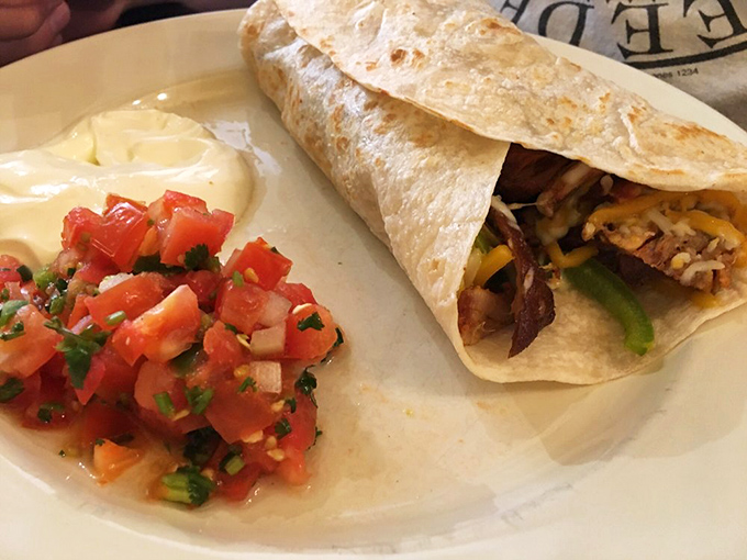 The pastor burrito: where marinated pork meets fresh vegetables in a tortilla embrace that would make even the most dedicated foodie weak at the knees.