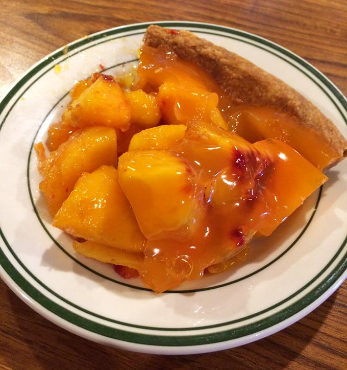 This peach pie doesn't need filters or fancy plating&mdash;just juicy fruit chunks swimming in their own sweet nectar, cradled by that perfect crust.