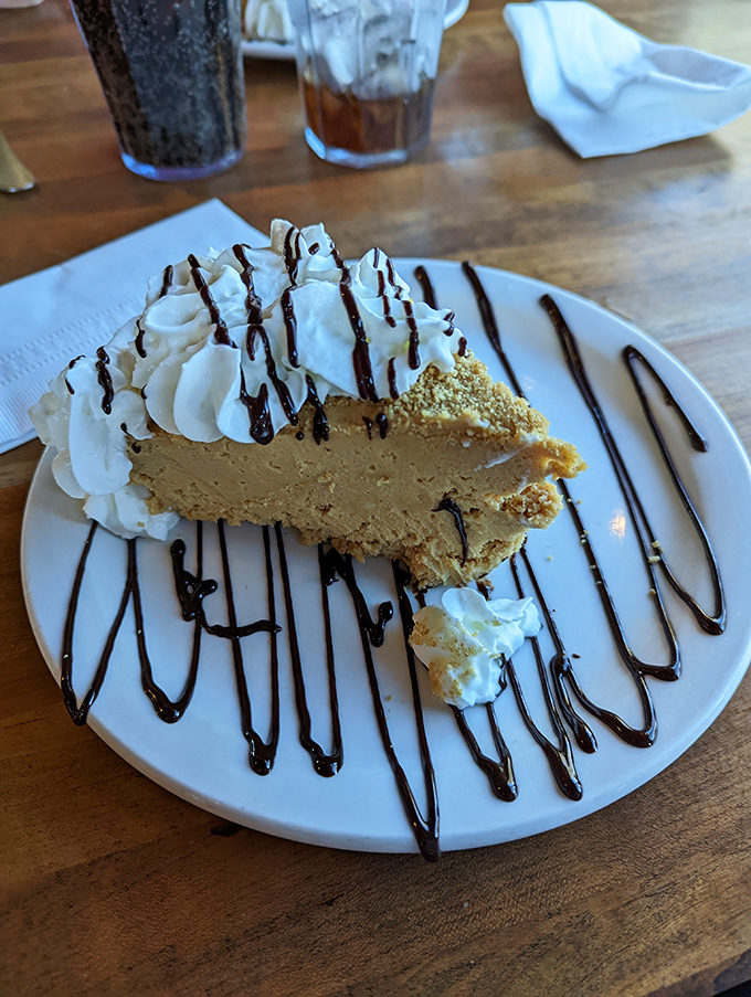 Not just peanut butter pie&mdash;a creamy dreamscape of nutty decadence drizzled with chocolate and topped with clouds of whipped cream.