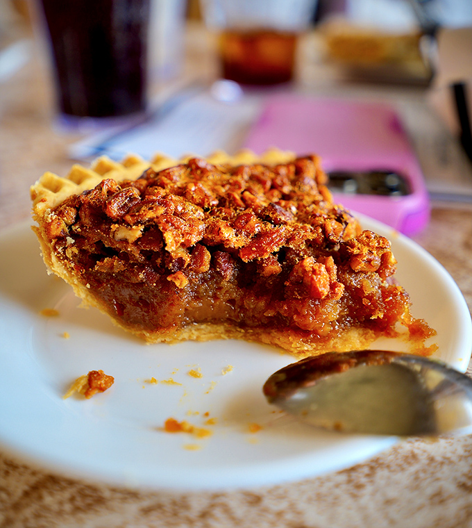 This pecan pie is what happens when butter, sugar, and nuts conspire to create something greater than the sum of their parts – gooey rebellion in its most delicious form.
