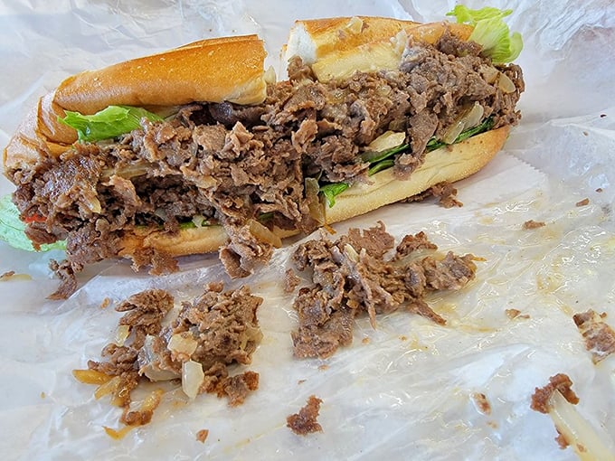 A proper Philly-style cheesesteak that doesn't need neon cheese or fancy presentation—just honest beef, caramelized onions, and a roll that means business.