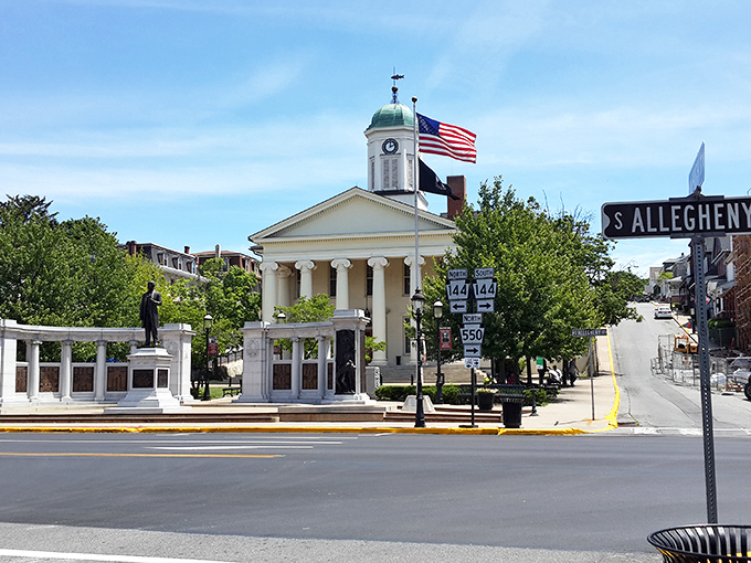 The Centre County Courthouse stands sentinel over Bellefonte, its classical columns a reminder that small-town governance doesn't require big-town taxes.