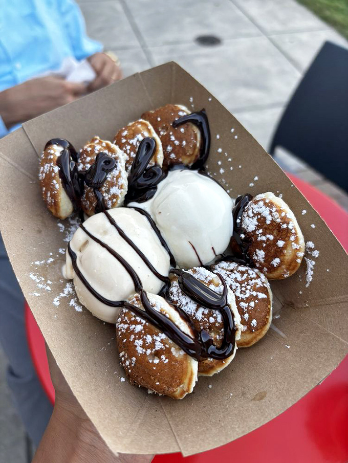 Dutch pancake puffs surrounding vanilla custard like planets orbiting a delicious sun. The powdered sugar "stars" complete this dessert galaxy.