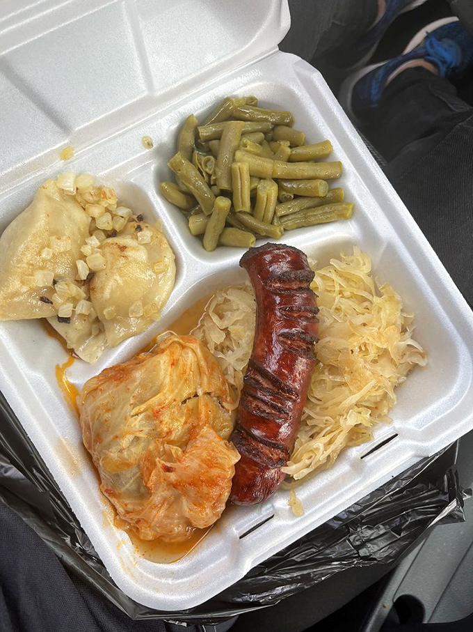 The Polish food sampler plate: where kielbasa, pierogies, cabbage, and green beans come together like a delicious family reunion.