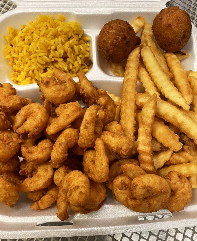 Popcorn shrimp mountain with sides that prove sometimes more really is more - and gloriously so.