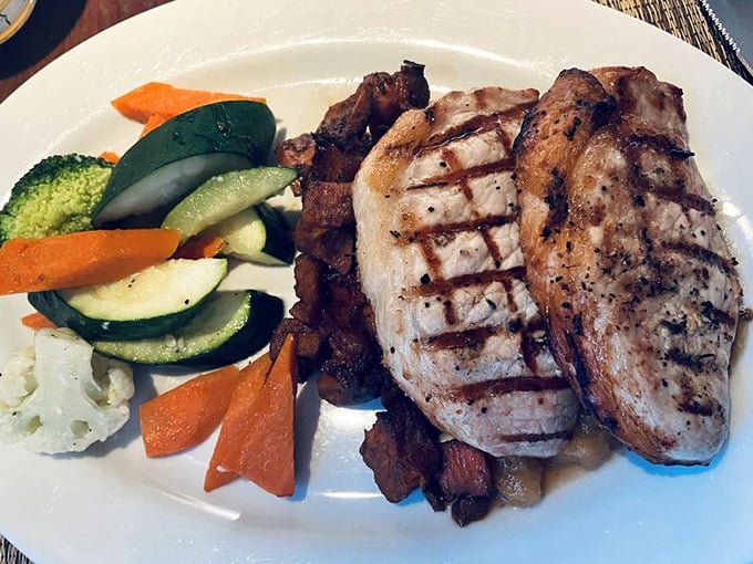 Perfectly grilled pork complemented by vibrant vegetables&mdash;proof that sometimes the simplest preparations yield the most profound flavors.