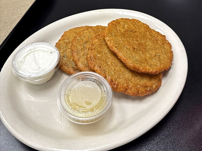 Golden-brown potato pancakes that could make your grandmother jealous. Crispy edges, tender centers, and two perfect dipping companions.