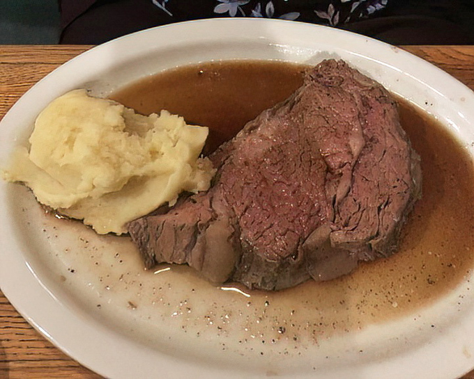 Prime rib so tender it practically surrenders to your fork. The au jus creates a savory swimming pool that transforms each bite into bliss.