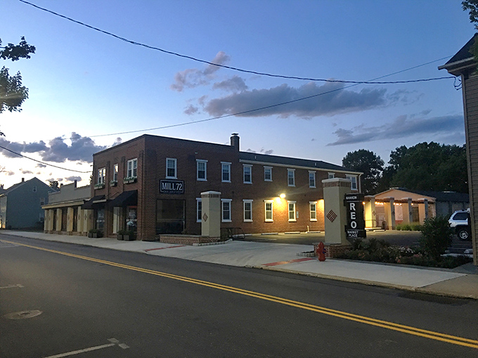 As evening settles on Mill 72, the warm glow from within promises comfort food and conversations that linger long after dessert.