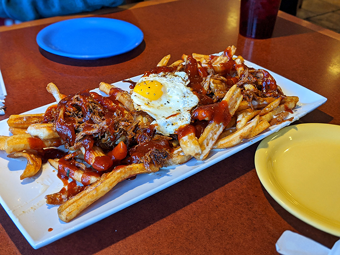 When fries meet pulled pork and a sunny-side-up egg, it's not just a meal &ndash; it's a declaration that calorie counting has been suspended for the day.
