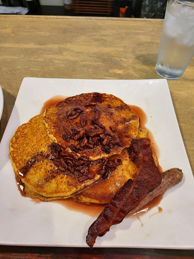 Pancakes that make you question why you ever settled for ordinary breakfast. Those pecans and that syrup are having the kind of relationship poets write about.