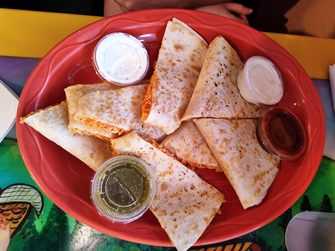 The quesadilla achieves that perfect golden exterior while hiding a treasure of melted cheese within&mdash;like a delicious pi&ntilde;ata waiting to be broken.