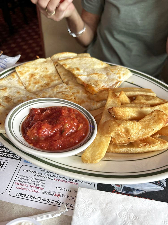 That moment when melted cheese meets perfectly crisped tortilla. The quesadilla &ndash; Mexico's gift to diner menus everywhere &ndash; served with a side of Jersey-sized fries.